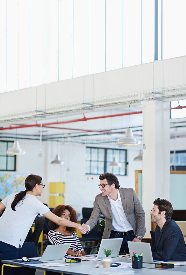 Congratulating the New Team Leader. Business People Around a Table ...