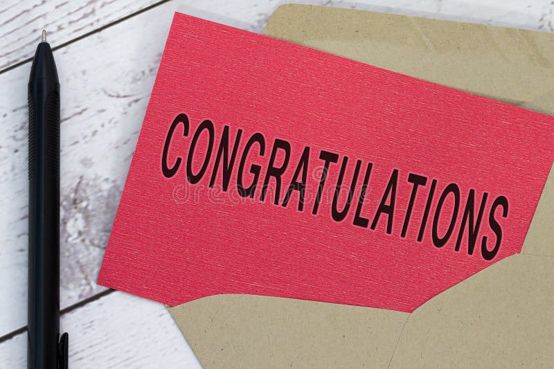 Congratulations Text on Red Card with Envelope and Pen on Wooden Table ...