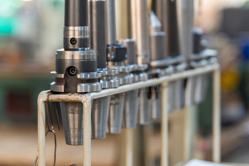 Conical and Collet Mandrels with Cutters and Drills on the Rack ...