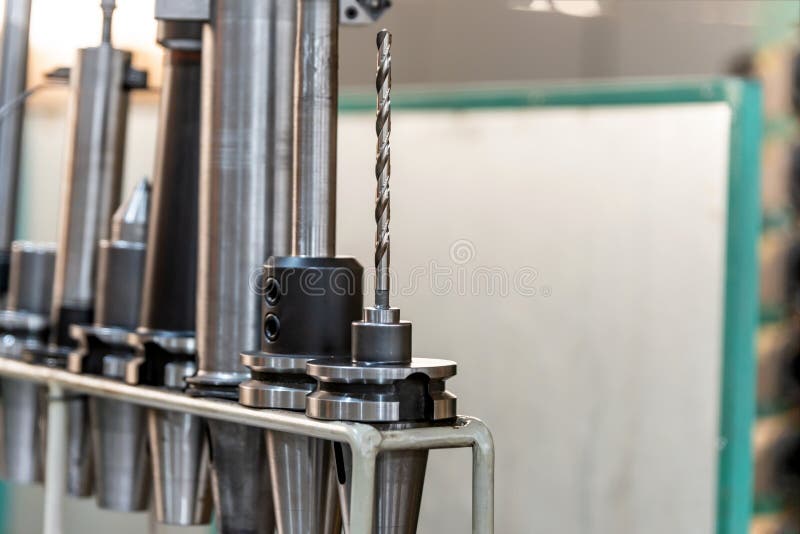 Conical and Collet Mandrels with Cutters and Drills on the Rack ...