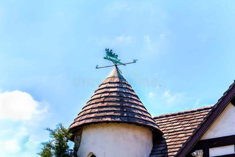 Conical Slat Roof and Winvane Stock Photo - Image of blue, charming ...