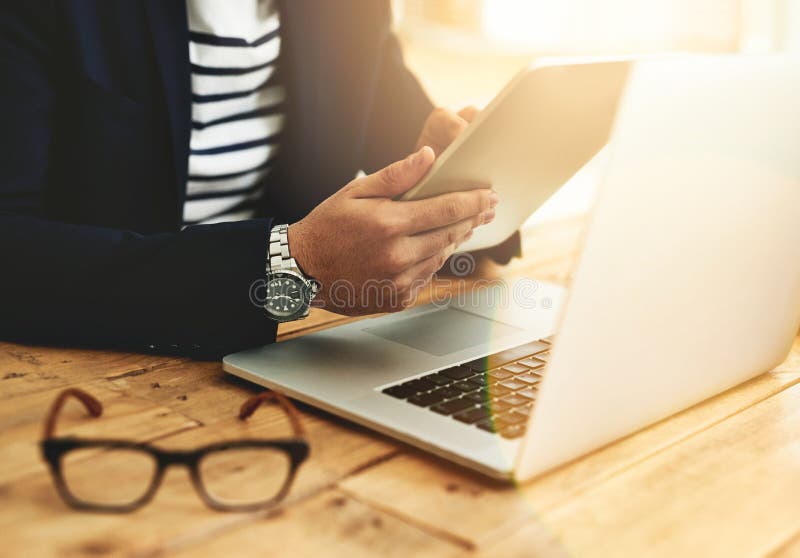 Connect and Keep Productive. a Businessman Using a Digital Tablet and ...