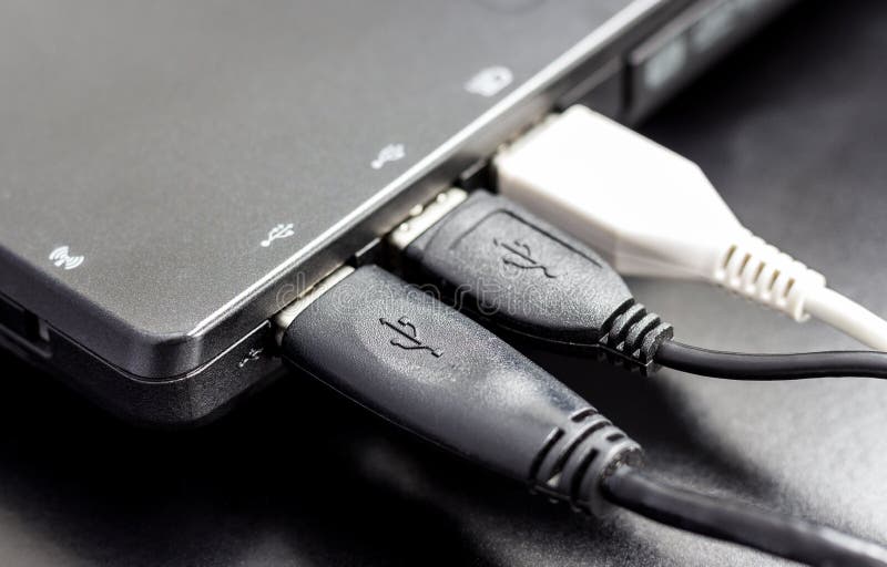 Connect Three USB Cable To Laptop Computer on Black Desk. Stock Image ...