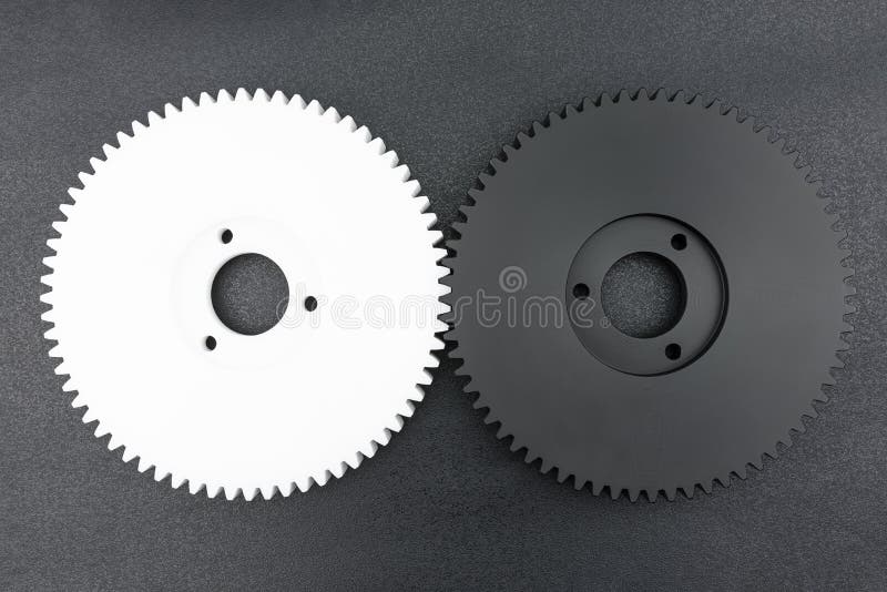 Connected Black and White Plastic Gear with 68 Sprockets on a Black ...