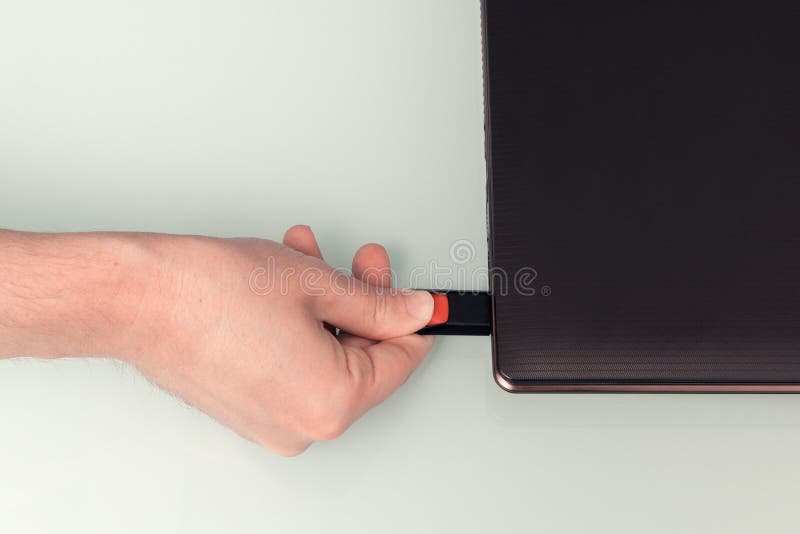 Connected with the Hand USB Memory Stick on the Laptop Stock Photo ...