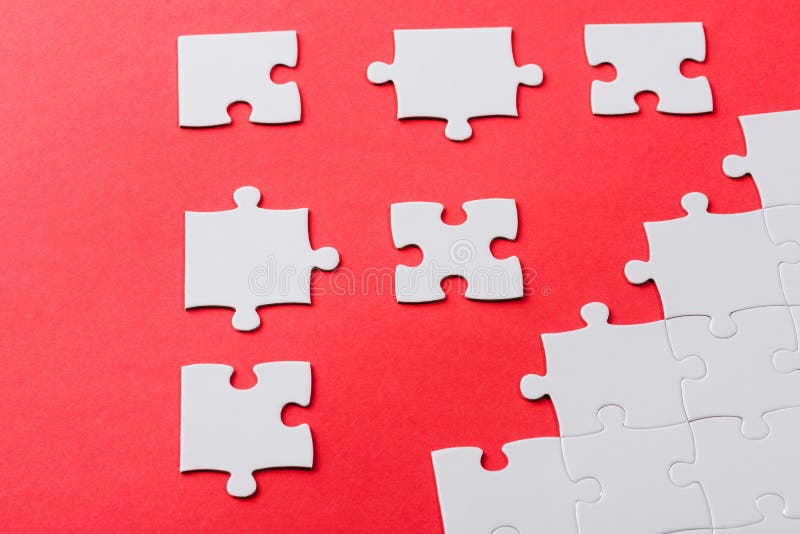 Connected and Separate Jigsaw Puzzle Pieces Isolated on Red Stock Image ...