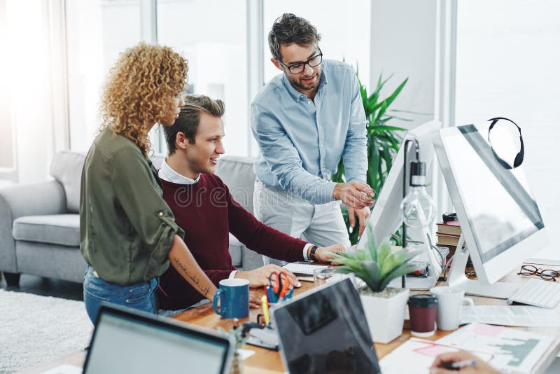 The Connected Team is an Productive Team. a Group of Colleagues Using a ...