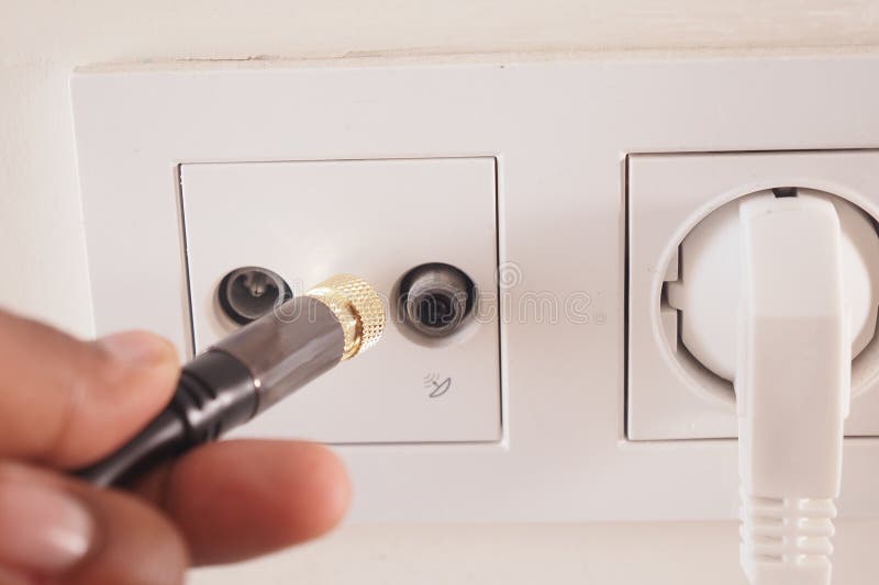 Connecting a Cable To an Electronic Socket at Home Stock Image - Image ...