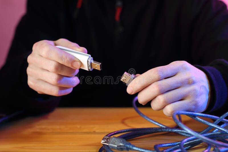Connecting a Card Modem To a Blue Usb Cable by a Person Stock Photo ...