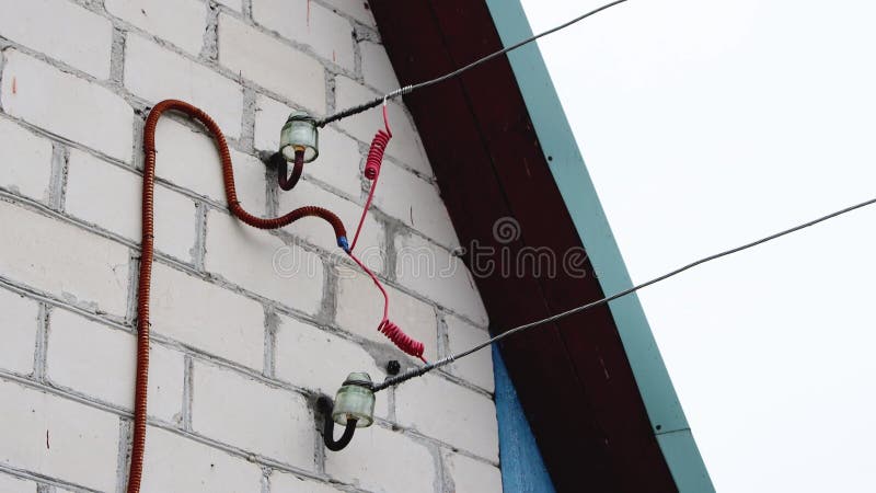 Connecting an Electric Cable from a Pole To a House by Air. Mounting ...