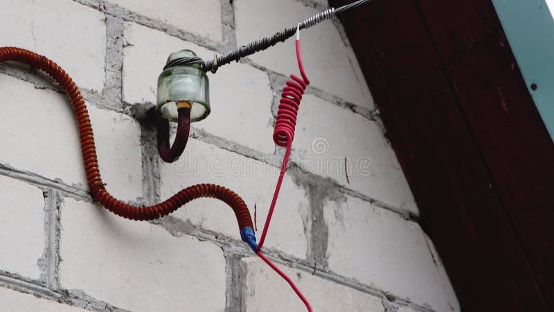 Connecting an Electric Cable from a Pole To a House by Air. Mounting ...