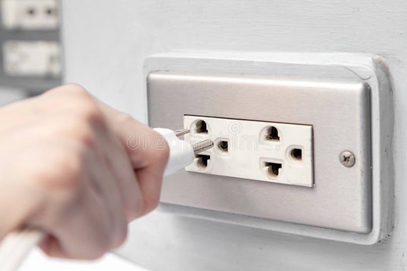 Connecting Electric Plug into Socket Stock Photo - Image of plug ...