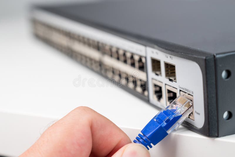 Connecting Ethernet Cable To Network Switch. Stock Image - Image of ...