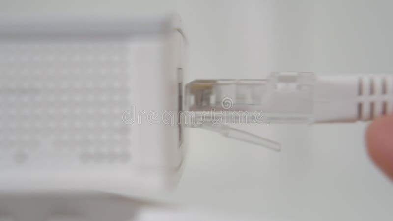 Plugging in Ethernet RJ-45 Cable into Internet Router Stock Footage ...