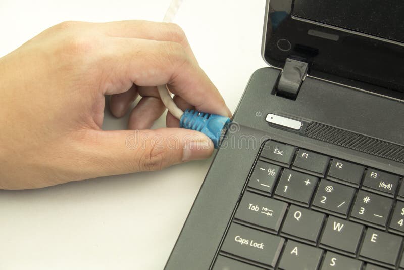 Connecting Network Wire with Computer Notebook Stock Photo - Image of ...