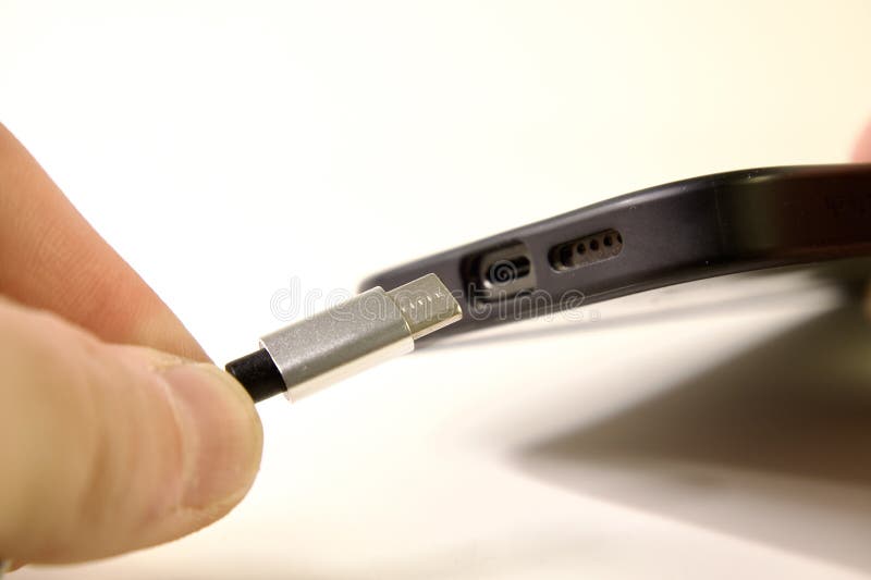 USB Type C Cable and Smartphone in Hand Stock Photo - Image of hands ...