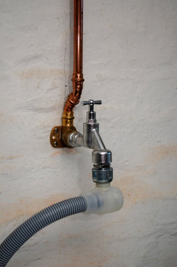 Connecting the Washing Machine Hoses To the Plumbing System Stock Photo ...