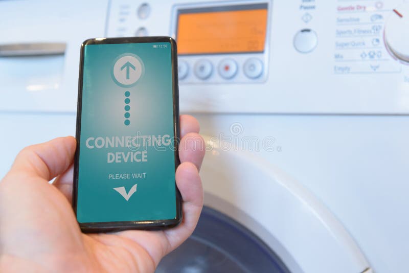 Connecting Washing Machine with Smart Phone Stock Photo - Image of hand ...