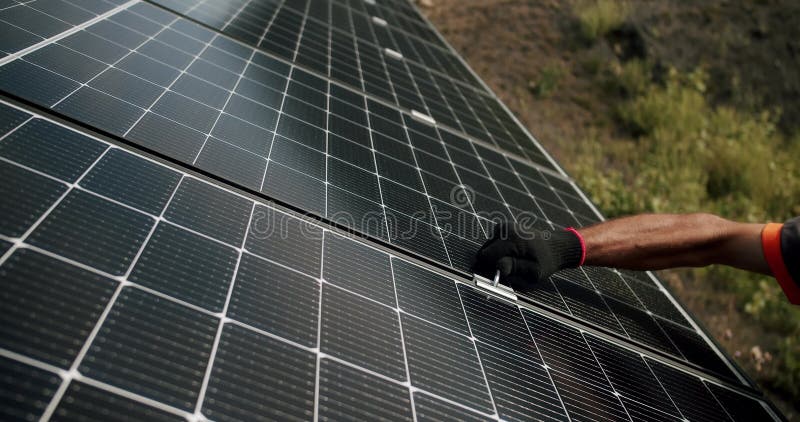 Worker Fasten Solar Panels. Technician Installing Solar Panels on Metal ...