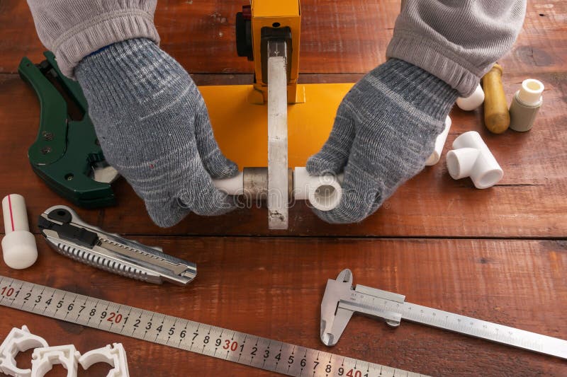 Connection of Plastic Pipes with a Welding Machine. Stock Photo - Image ...