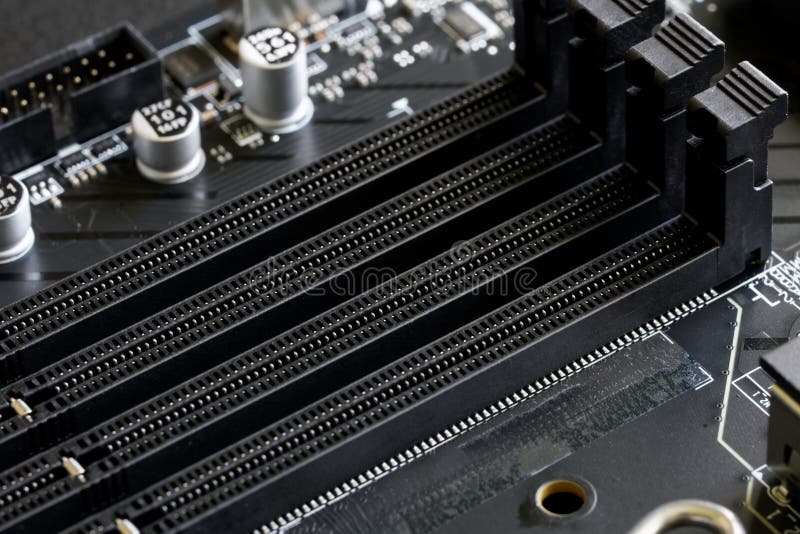 Connectors for Installing DDR5 RAM on a Black Motherboard of a Modern ...