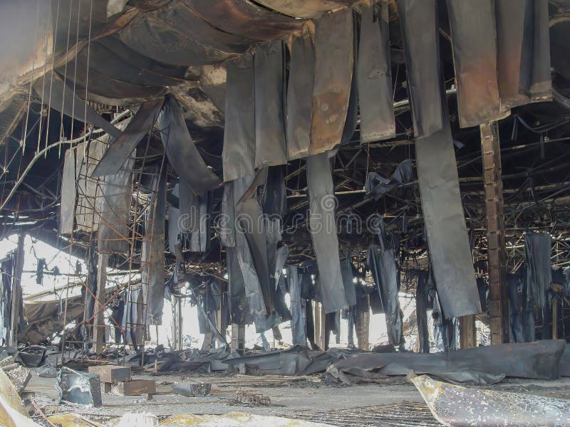 The Consequences of a Fire in a Warehouse, Black Charred Steel Sheets ...