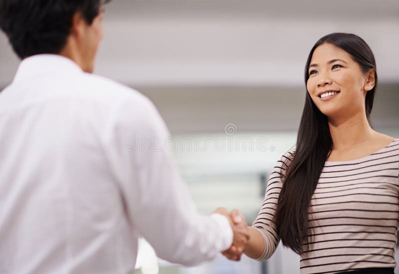 Consider Yourself Hired. Two Business Professionals Shaking Hands in an ...