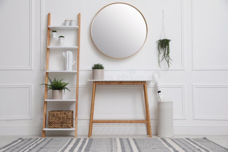 Console Table with Shelving Unit and Mirror on White Wall in Hallway ...