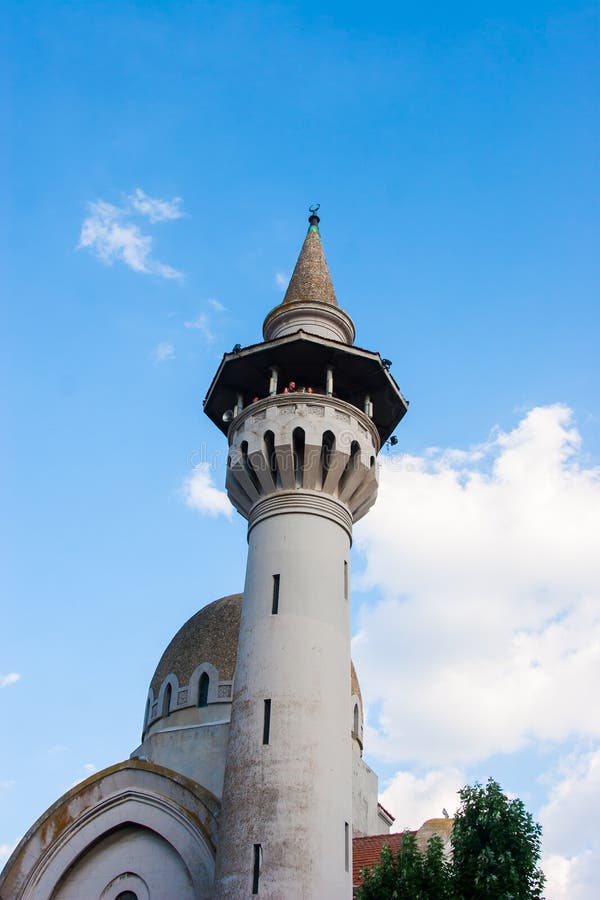 CONSTANTA, ROMANIA - AUGUST 21, 2010. Tower of the Mosque with Tourists ...