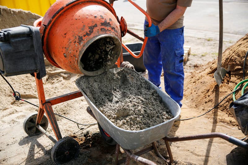 Constriction Worker Making Concrete in an Orange Mixer Stock Image ...