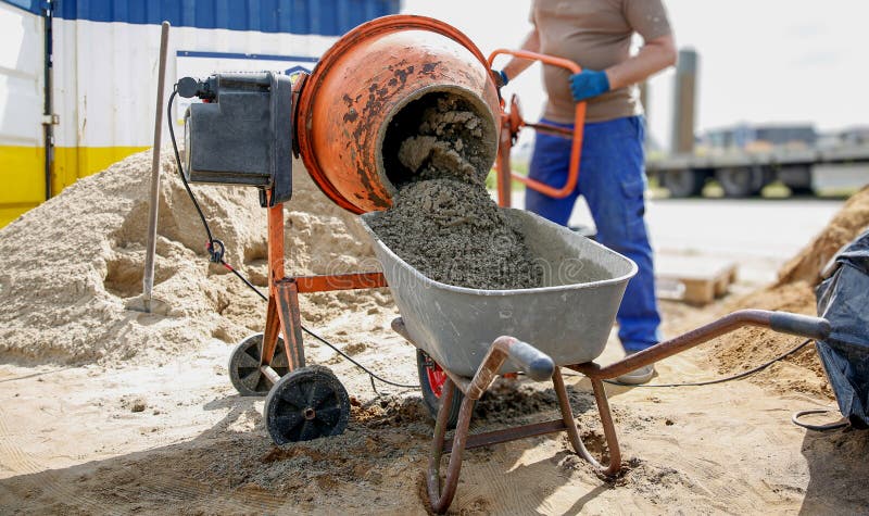 Constriction Worker Making Concrete in an Orange Mixer Stock Image ...