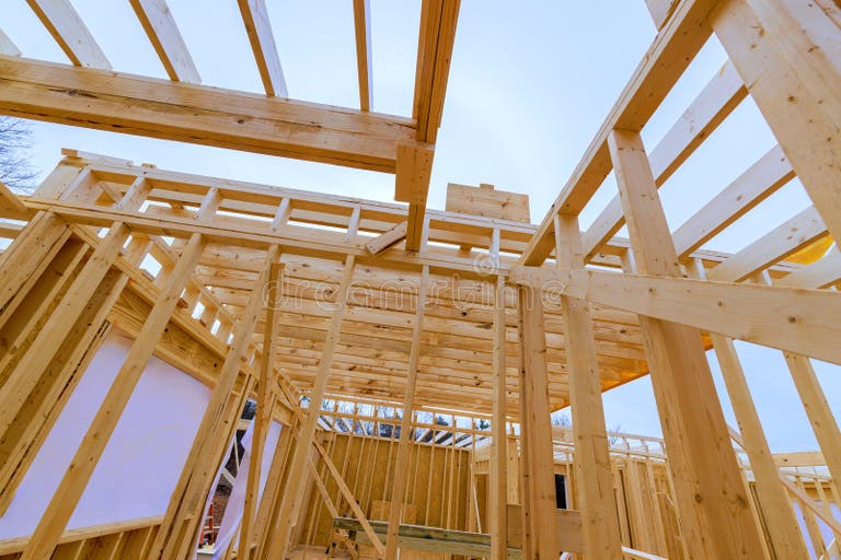 Construction of a Wooden Framework in a New Building Under Clear Sky ...