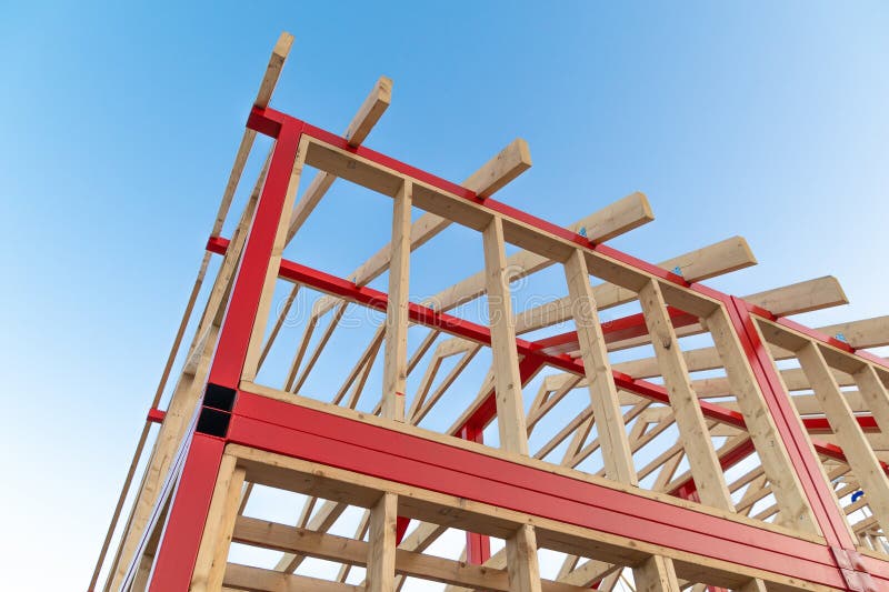 Constructing a Wooden and Steel Frame Structure Against Clear Sky Stock ...