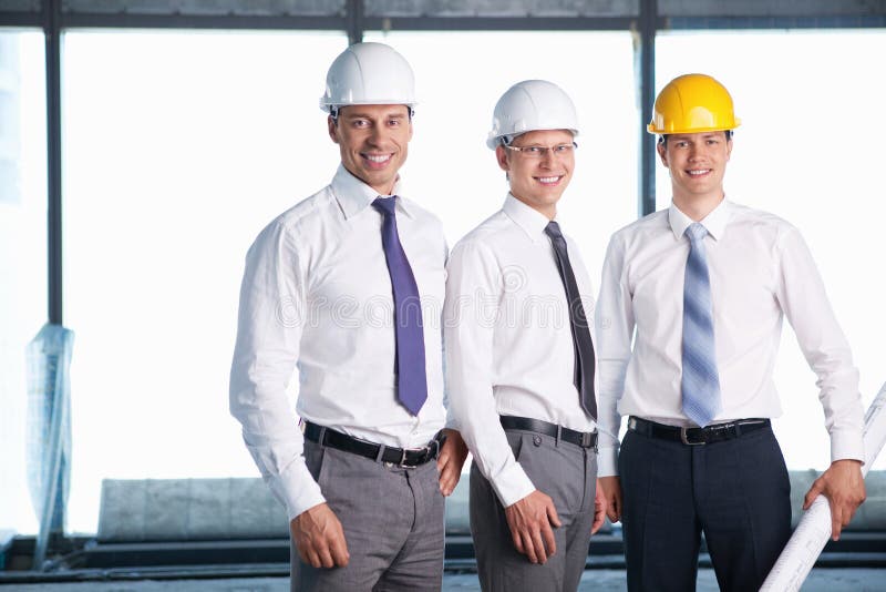 Workers with Hard Hats in Maintenance Room Stock Photo - Image of ...