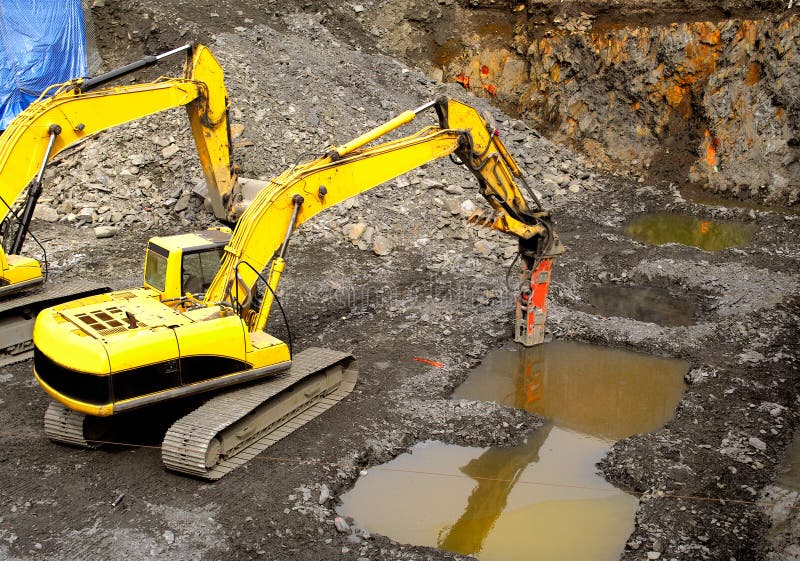 Mini Excavator Digging Up a Electrical Cables from Trench 3 Stock Photo ...