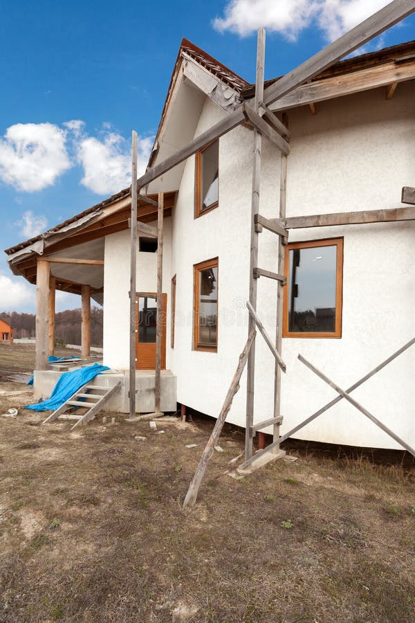 Construction of Adobe House with Thatched Roof and Plastic Windows ...