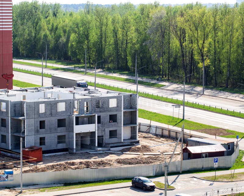 Construction of an Apartment Building Against the Backdrop of a Forest ...