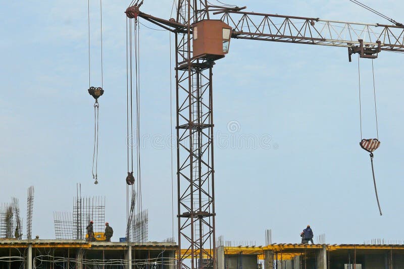 Construction of an Apartment Building, the Work of Cranes and People ...