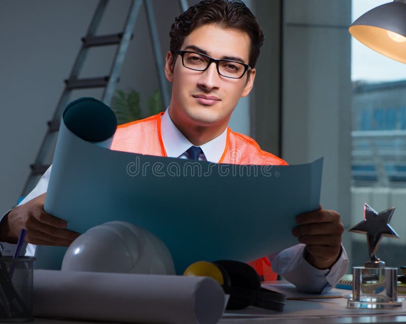 Construction Architect Working on Drawings Late at Night Stock Photo ...