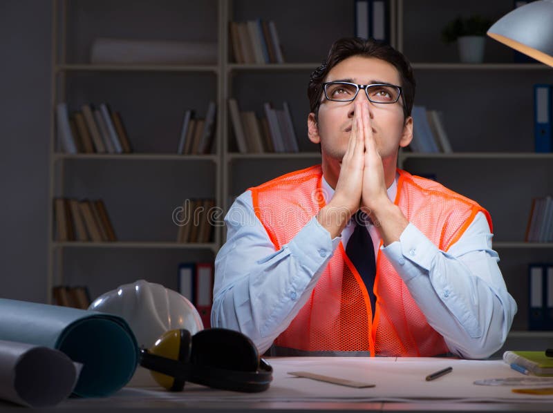 Construction Architect Working on Drawings Late at Night Stock Photo ...