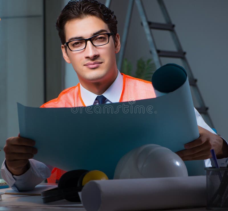 Construction Architect Working on Drawings Late at Night Stock Photo ...