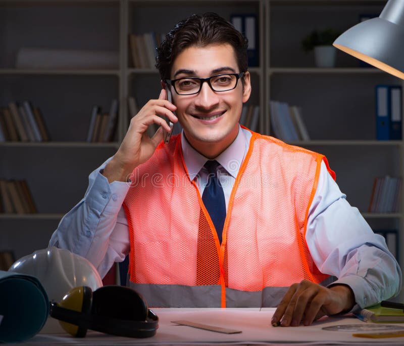 Construction Architect Working on Drawings Late at Night Stock Photo ...