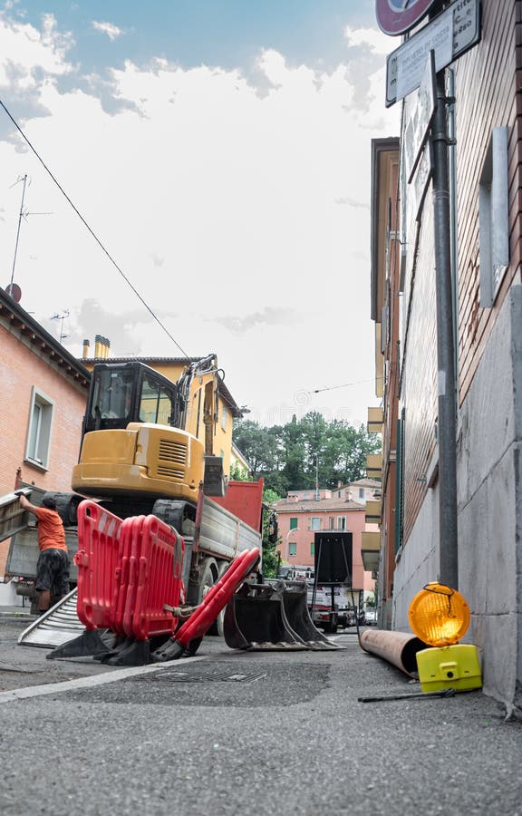 Construction Area with Operators Deploying Barrier, Excavator and ...