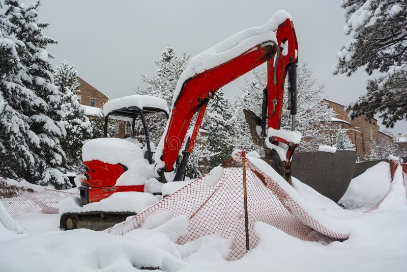 Construction Backhoe Stopped on a Frozen Snow Day Stock Image - Image ...