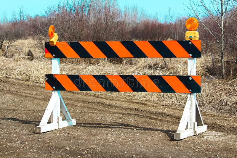 A Construction Barricade on a Gravel Road Stock Photo - Image of ...