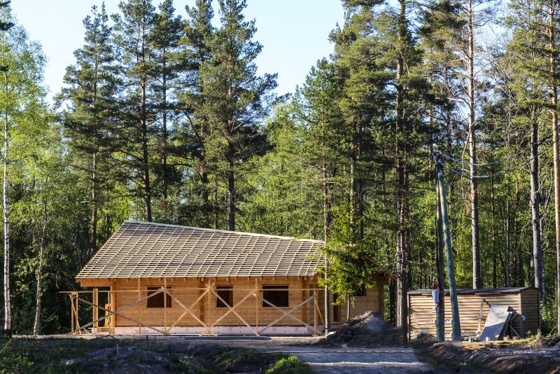 Construction of a Beautiful House Made of Timber, Harmoniously Fitting ...