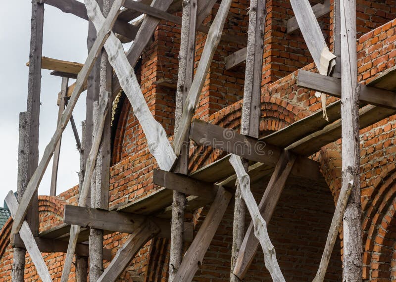 Construction of a Bell Tower and a Church. Brick Wall Stock Photo ...
