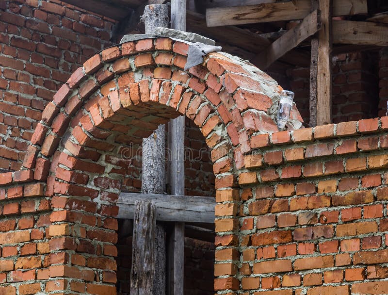 Construction of a Bell Tower and a Church. Brick Wall Stock Image ...