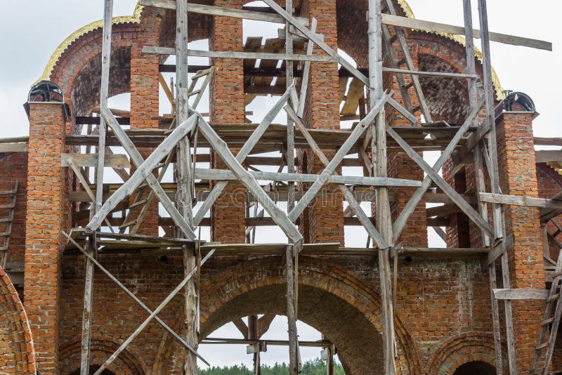 Construction of a Bell Tower and a Church. Brick Wall Stock Image ...