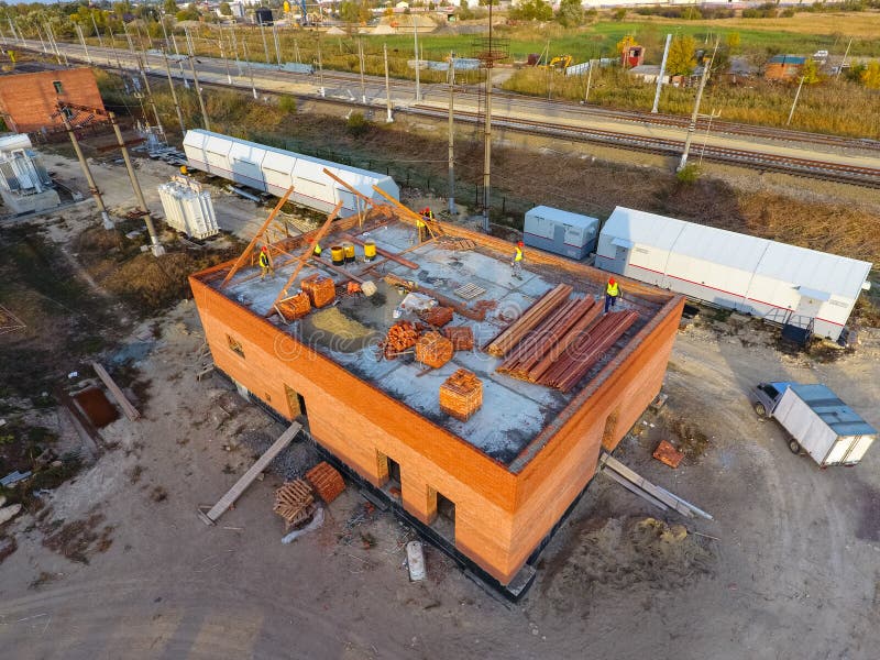 Construction of a Brick Building. Installation of the Roof ...